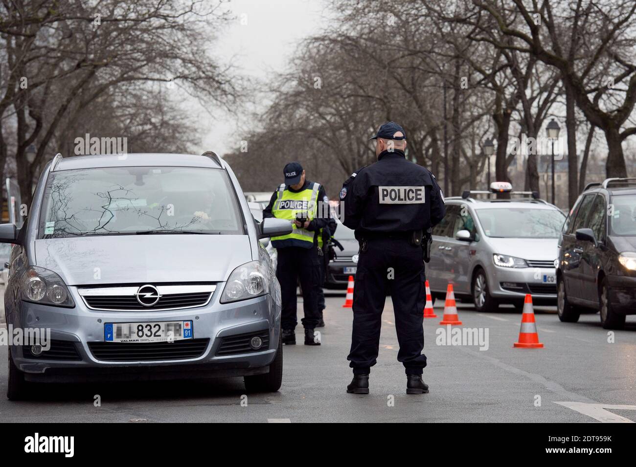 Police officers control cars with number plates ending in even numbers ...