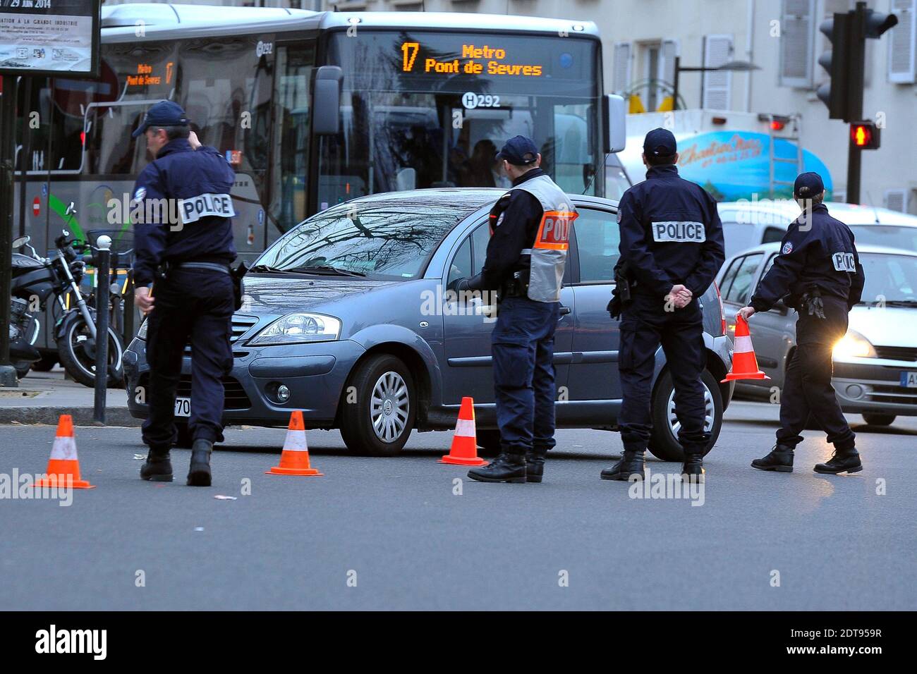 Police officers control cars with number plates ending in even numbers ...