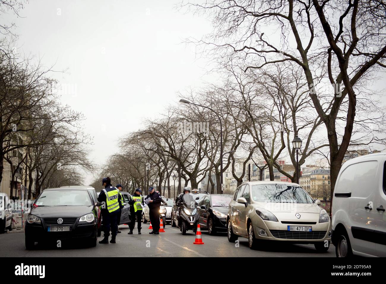Police officers control cars with number plates ending in even numbers ...