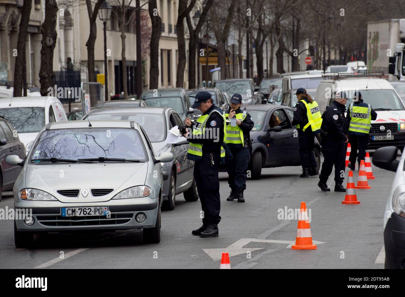 Police officers control cars with number plates ending in even numbers ...