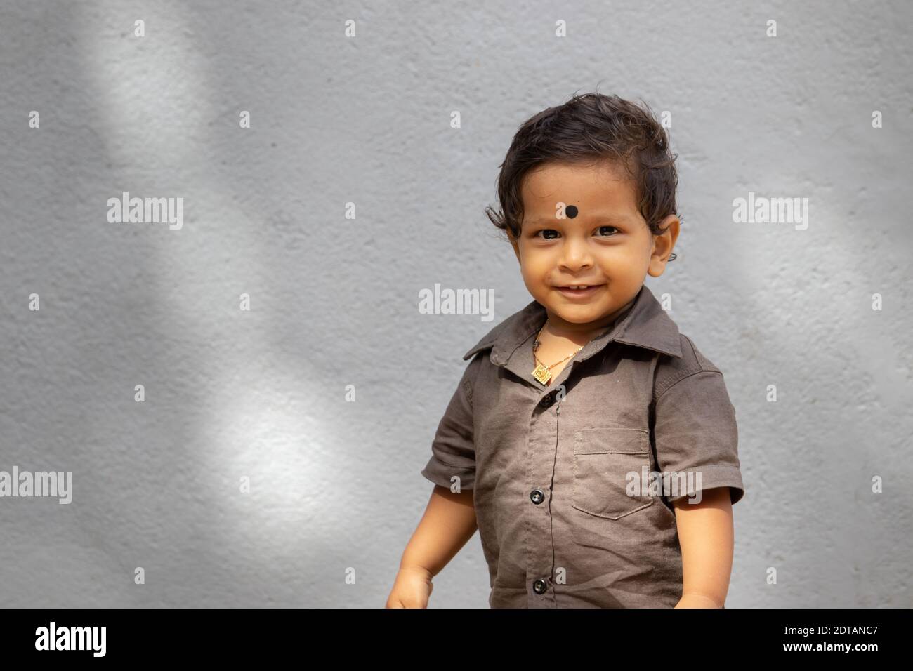 Galle, Sri Lanka - 06 08 2020: 1-year-old kid playing outside of the ...