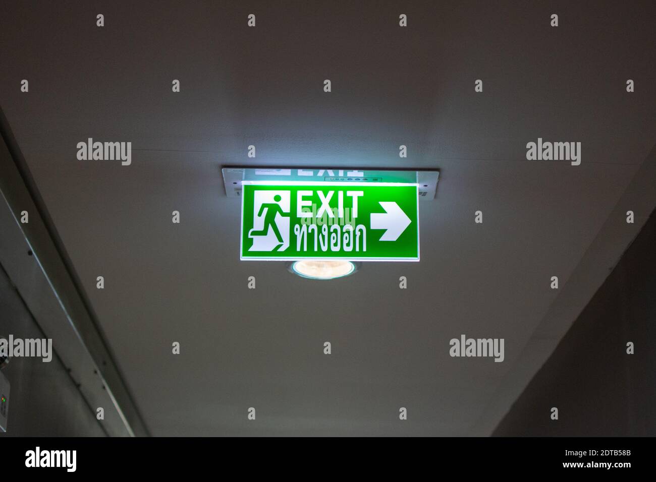 Exit sign hanging on ceiling hi-res stock photography and images - Alamy
