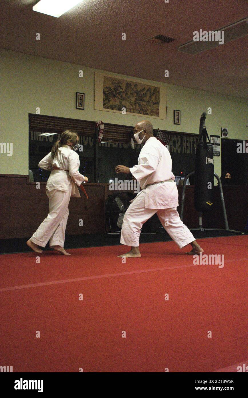 This action photo is of my daughter in her Karate class. Karate is a ...