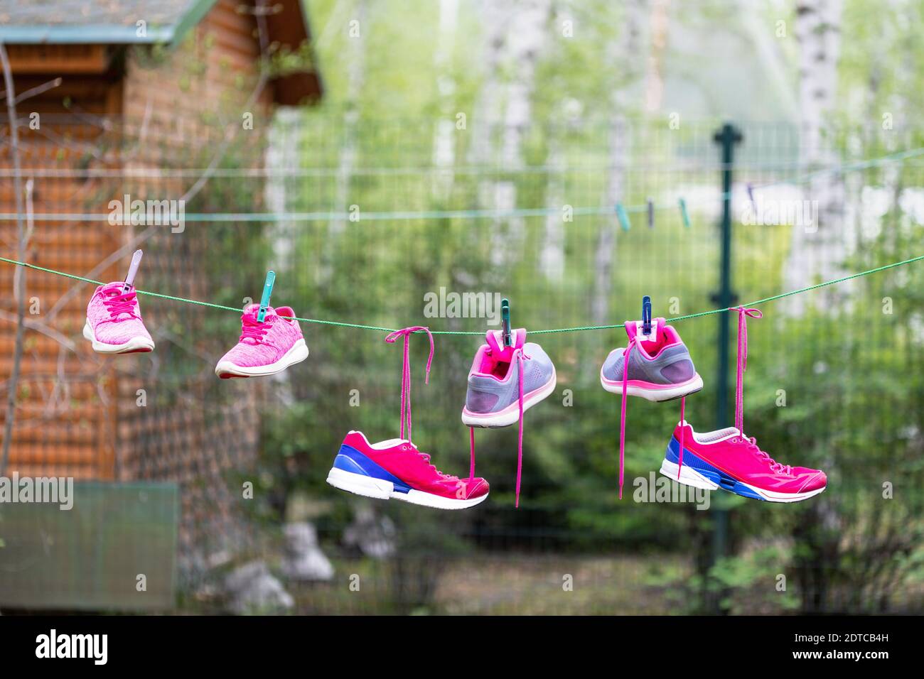 Shoes Hanging On Clothesline Stock Photo - Alamy