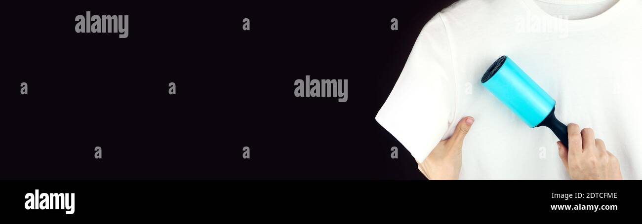 Clothing with static cling banner. White t-shirt on a dark background ...