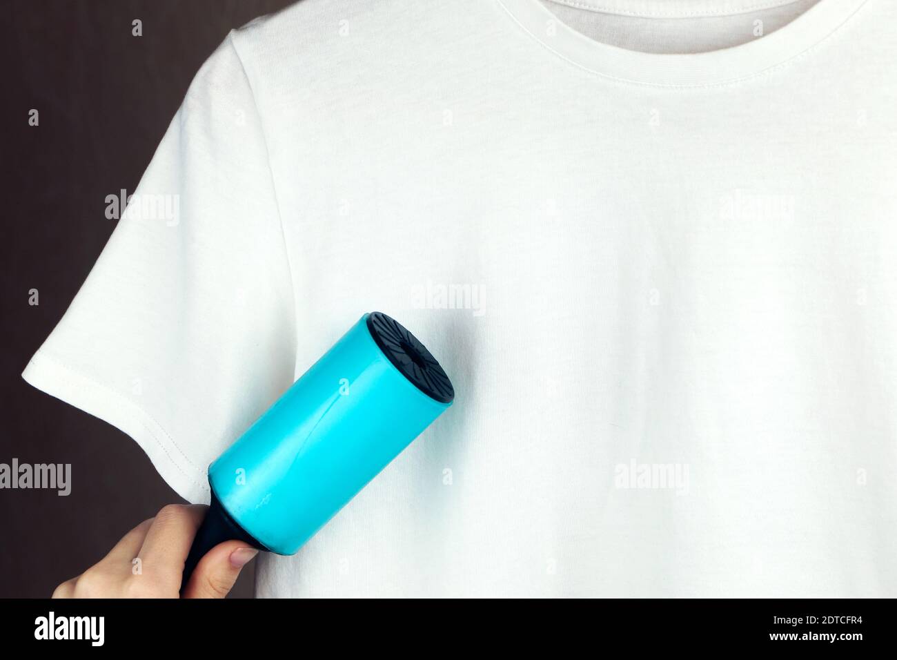 Clothing with static cling banner. White t-shirt on a dark background ...