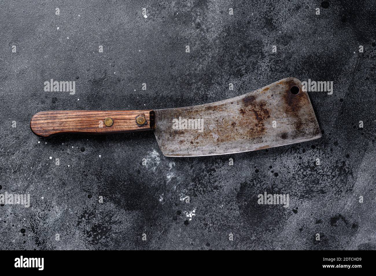 Vintage butcher cleaver with wooden handle. Black background. Top view ...