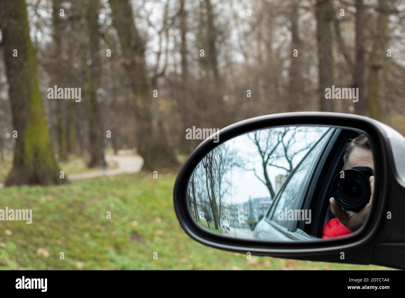 Tracking a private detective hidden photography with a car. Reflection ...