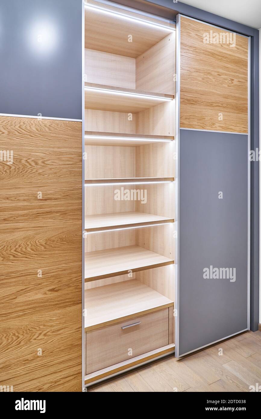 Stylish large wardrobe with LED lighting, sliding doors, shelves and ...