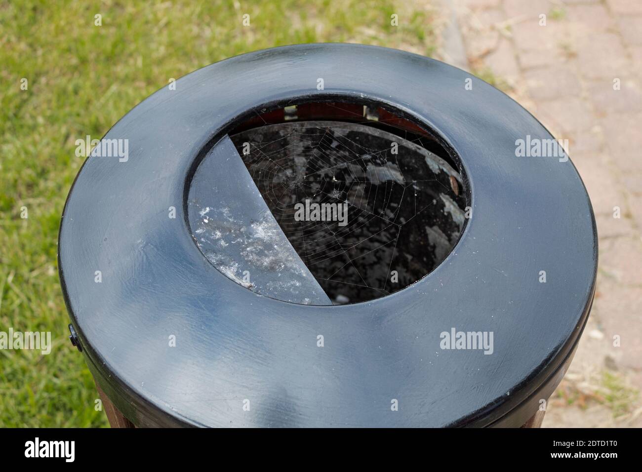 Garbage can with cobwebs around. Web and urn concept in city park Stock ...