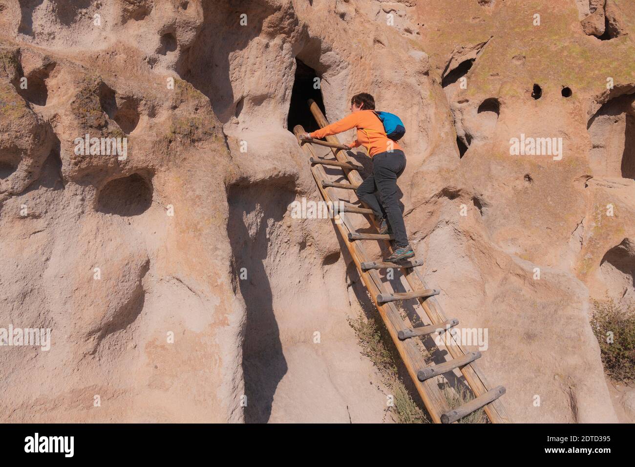 Woman climbing ladder hi-res stock photography and images - Alamy