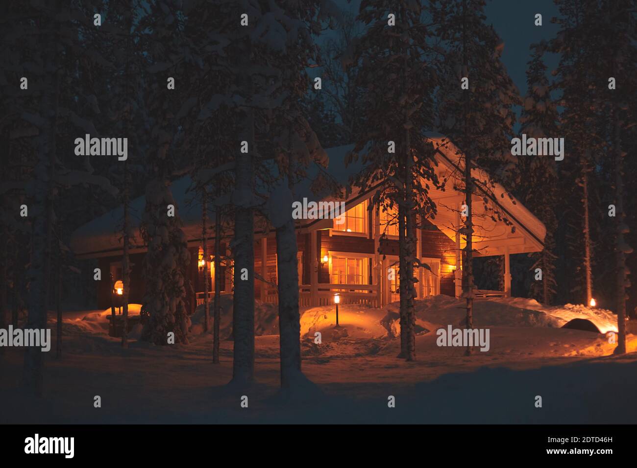 A night view of cozy wooden scandinavian cabin cottage chalet house ...