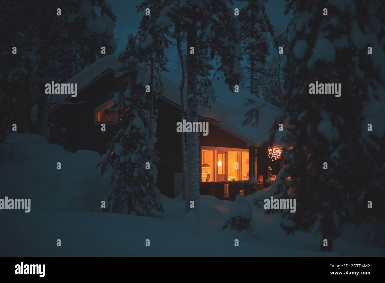 A night view of cozy wooden scandinavian cabin cottage chalet house ...