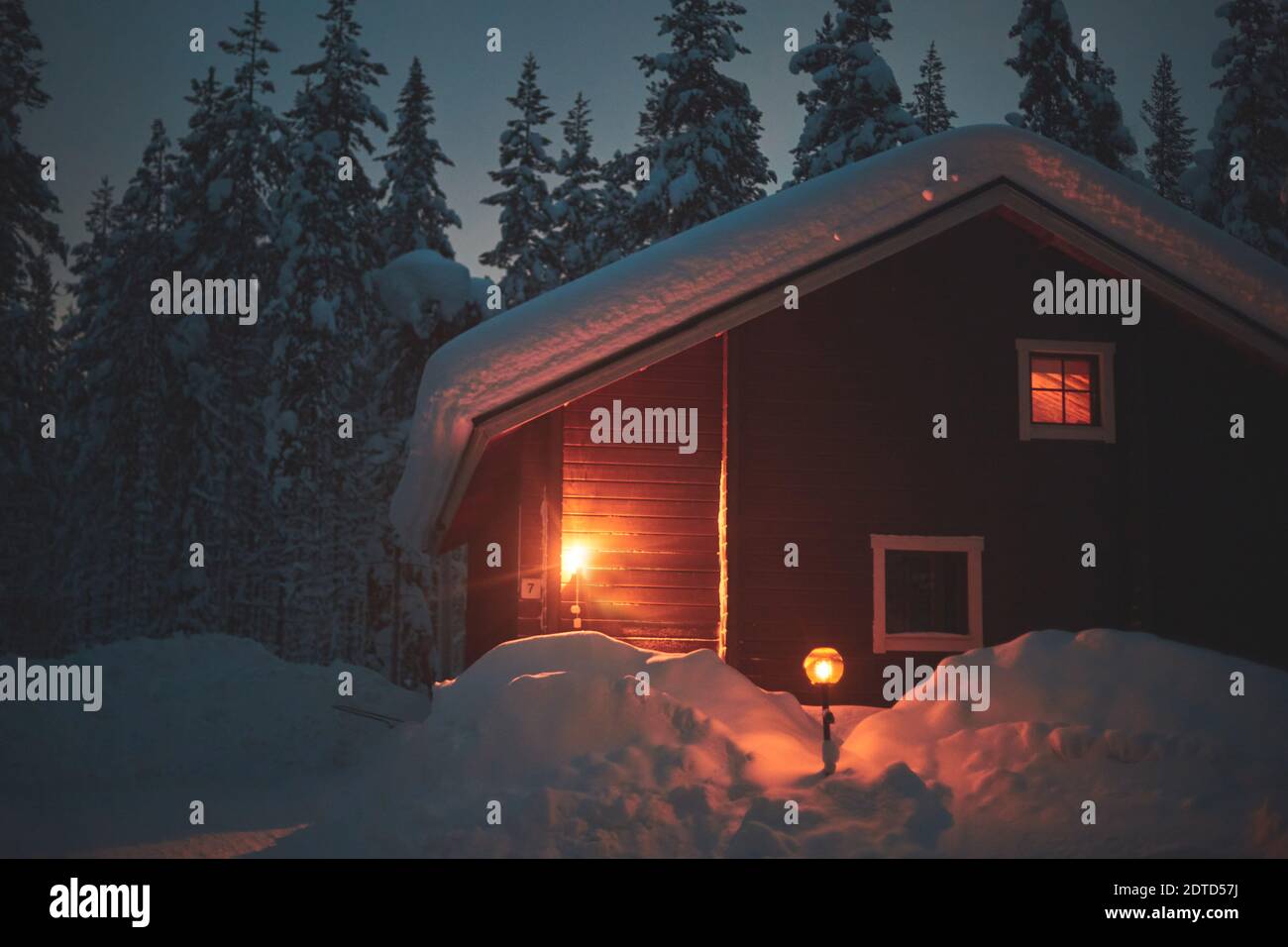 A night view of cozy wooden scandinavian cabin cottage chalet house ...