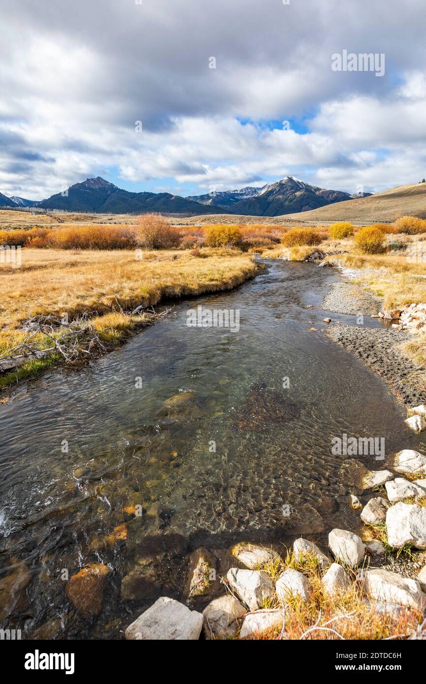 USA, Idaho, Stanley, Landscape with stream and mountains in distance ...
