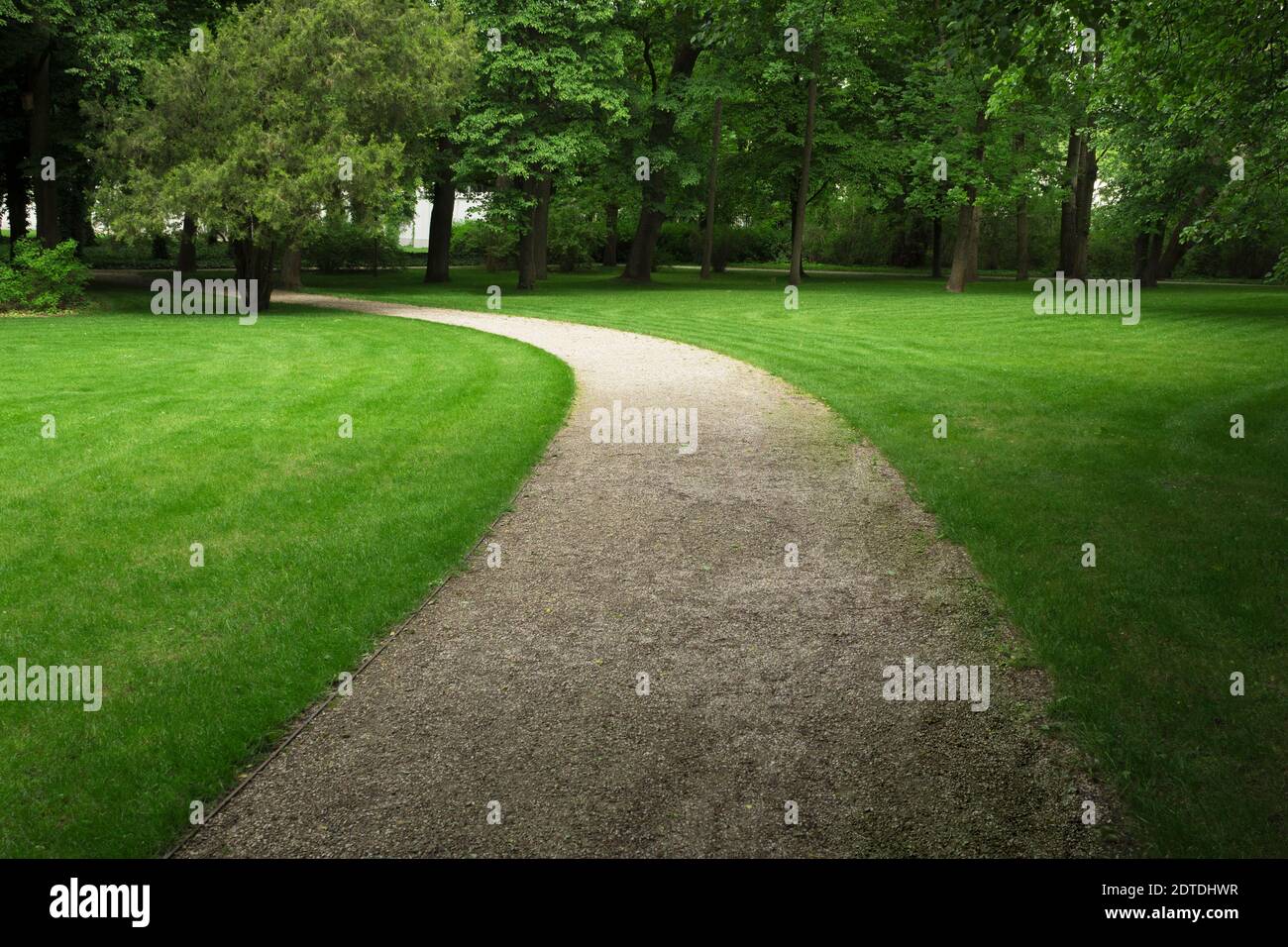 The path in the park is made of stone. Paving stones in a city park ...