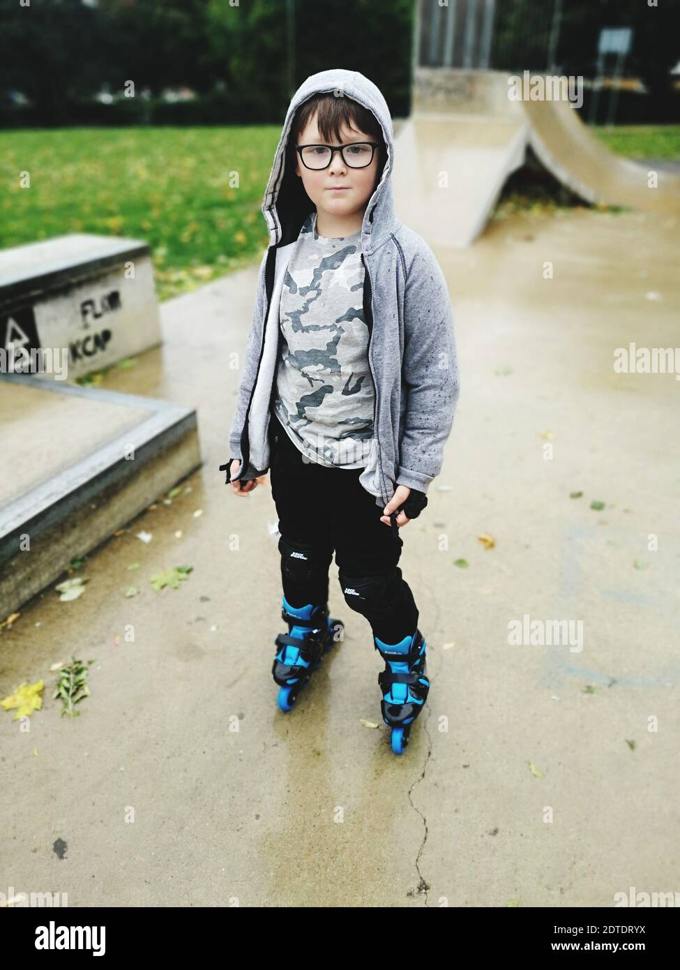 Boy inline skating outdoors hi-res stock photography and images - Alamy