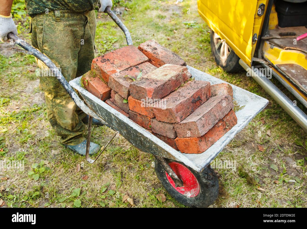 Construction site bricks in wheelbarrow hi-res stock photography and ...