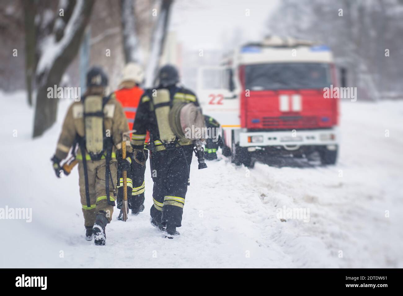 Group of fire men in uniform, firefighters with the a engine truck ...