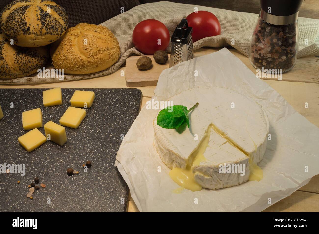 Camembert cheese and gouda cheese side view. Two types of cheese are ...