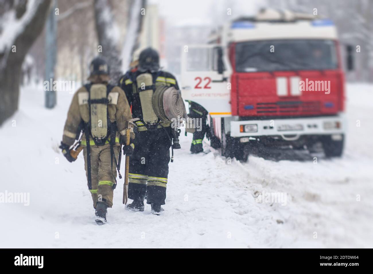 Group of fire men in uniform, firefighters with the a engine truck ...