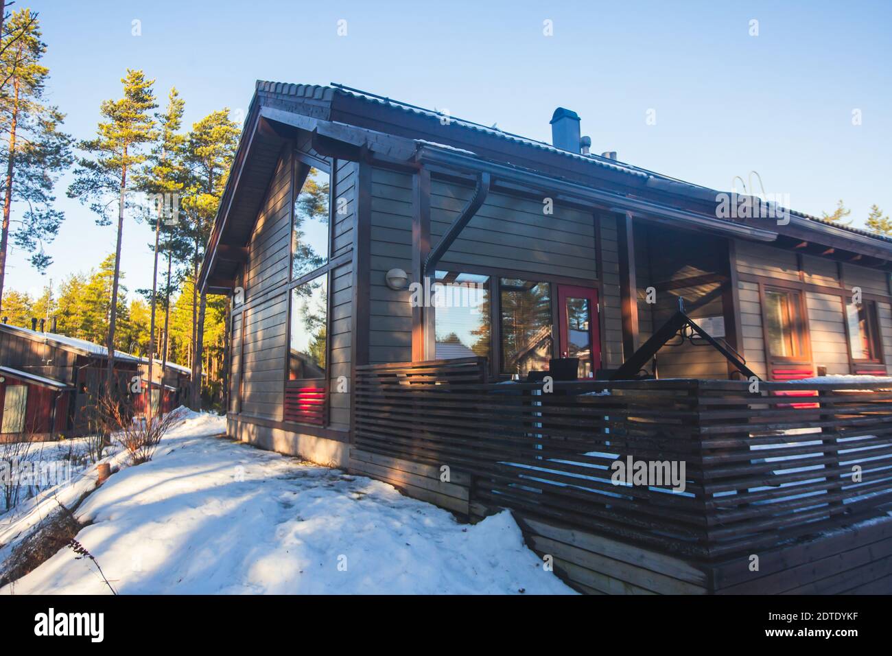 A view of cozy wooden scandinavian cabin cottage chalet house covered ...