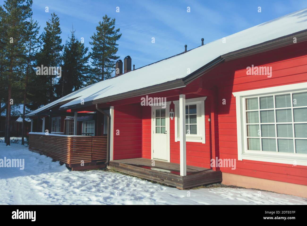 A view of cozy wooden scandinavian cabin cottage chalet house covered ...
