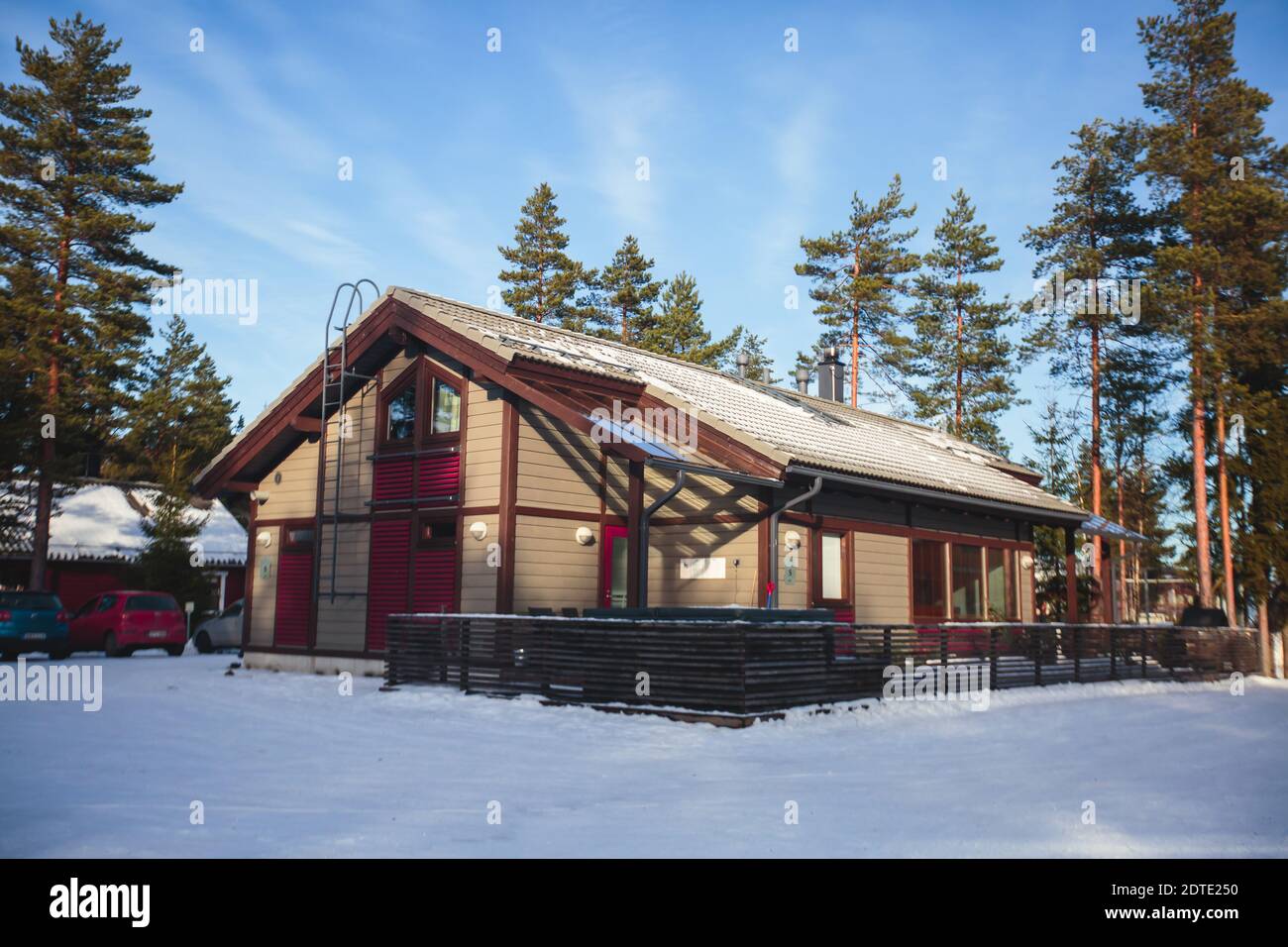 A view of cozy wooden scandinavian cabin cottage chalet house covered ...