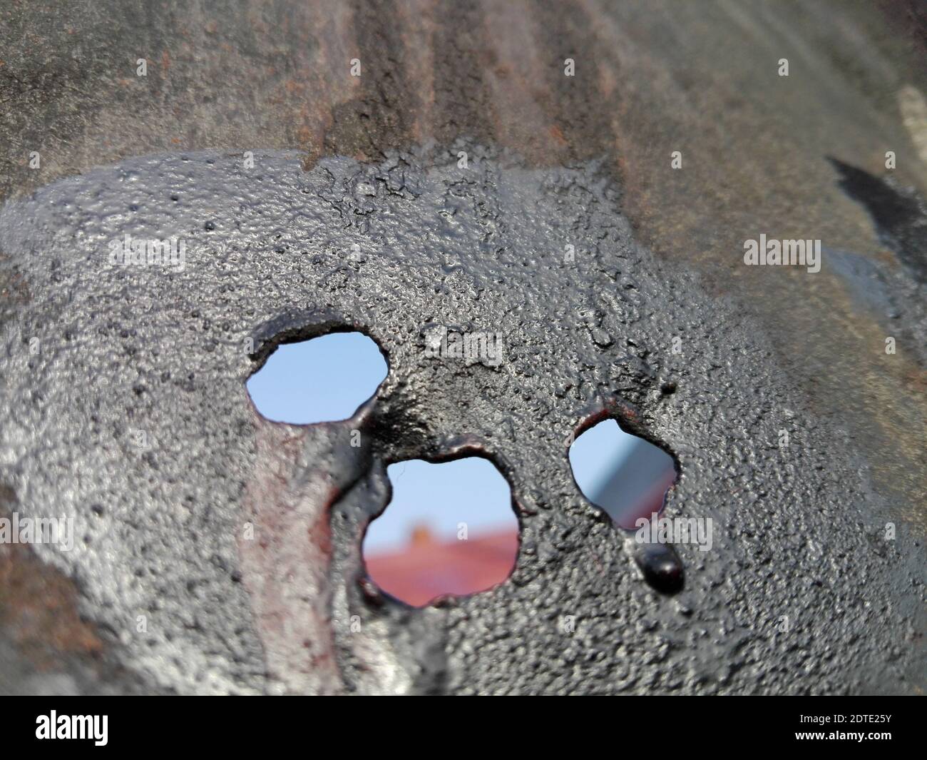 Holes in rusty metal hi-res stock photography and images - Alamy