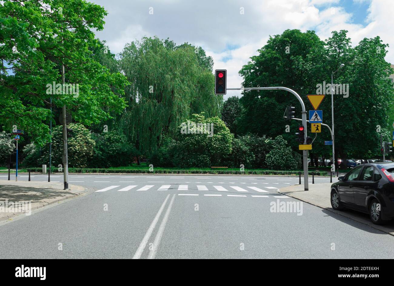 Red traffic light at a crossroads. Prohibitory traffic light sign Stock ...