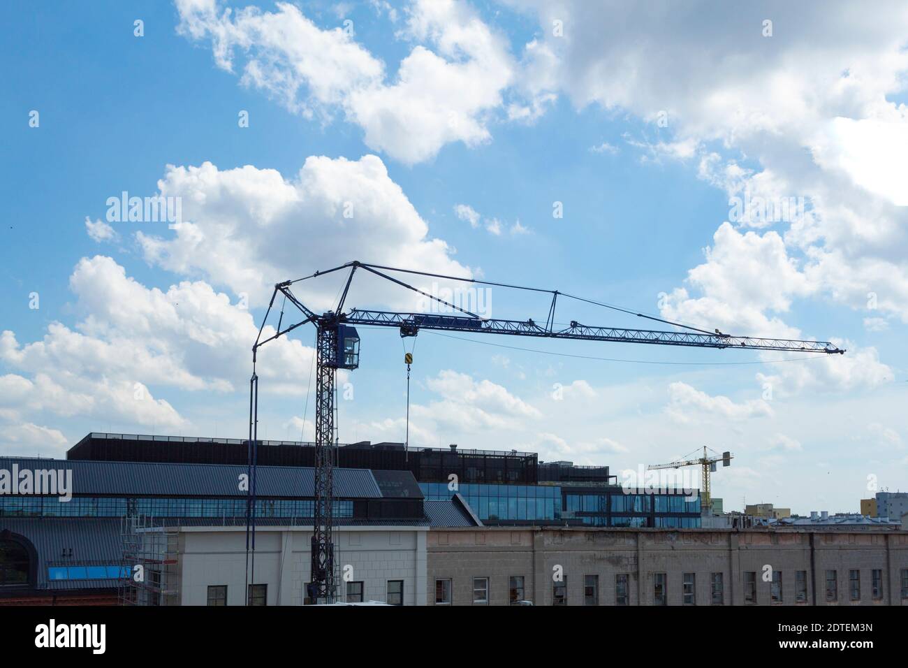 Crane for lifting building materials. Tower crane on the background of ...