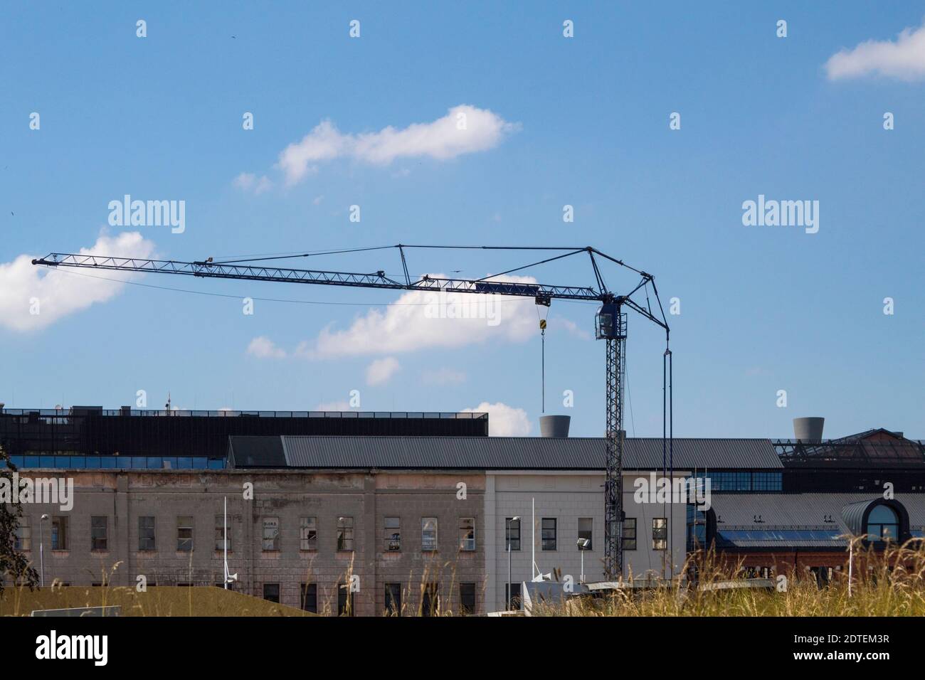 Crane for lifting building materials. Tower crane on the background of ...