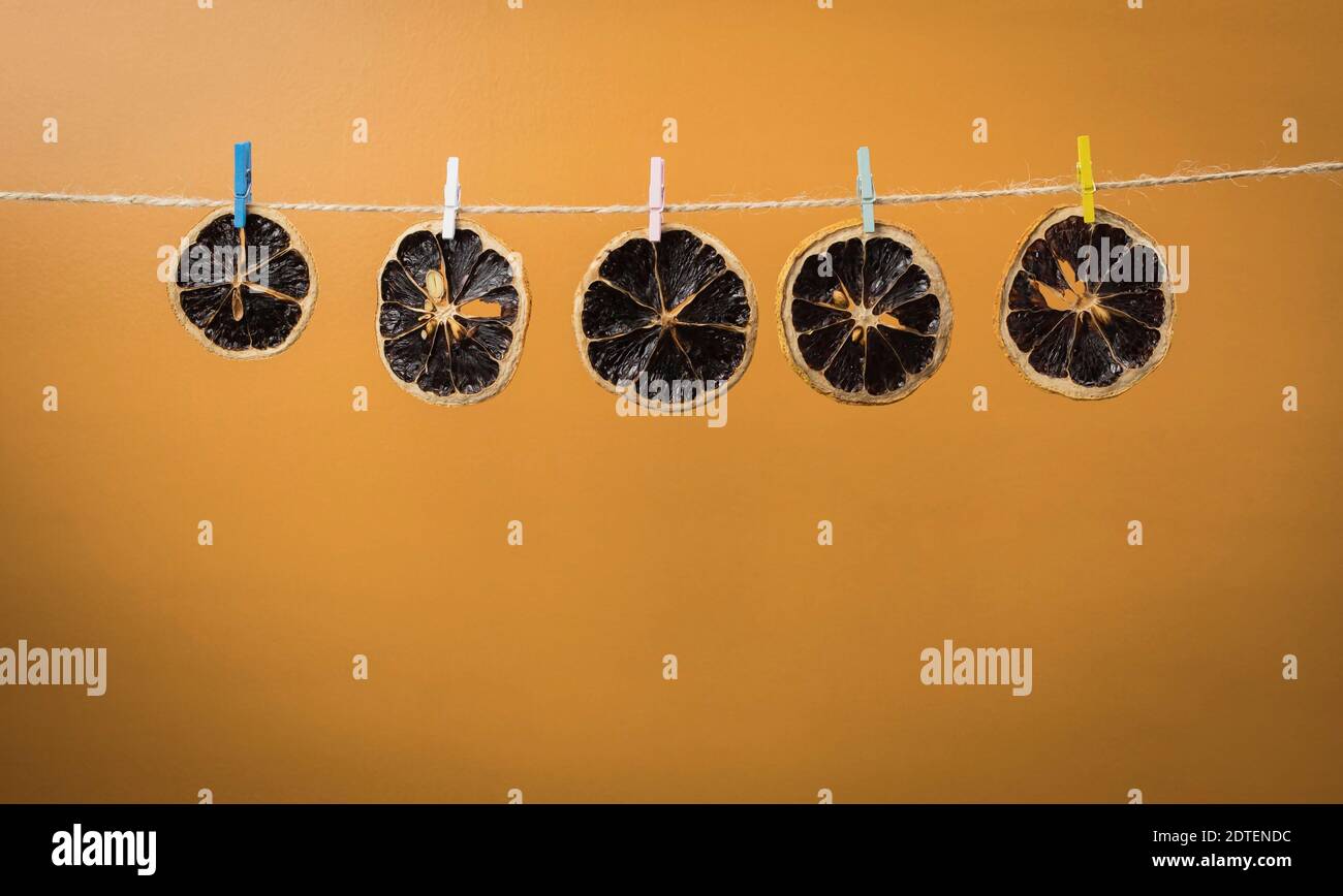 Dry lemon slices on a rope Stock Photo - Alamy