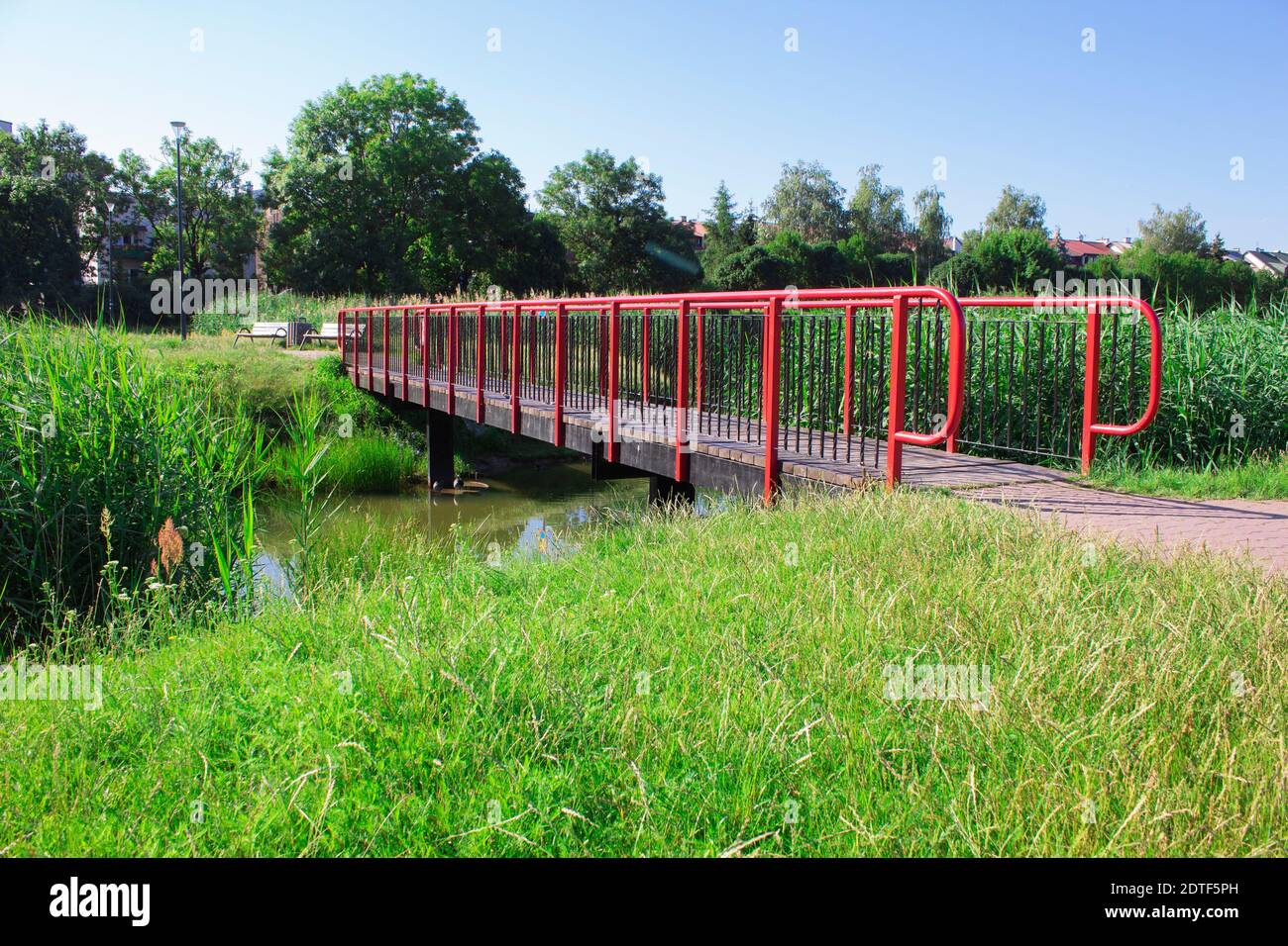 New iron bridge over a small river Stock Photo - Alamy