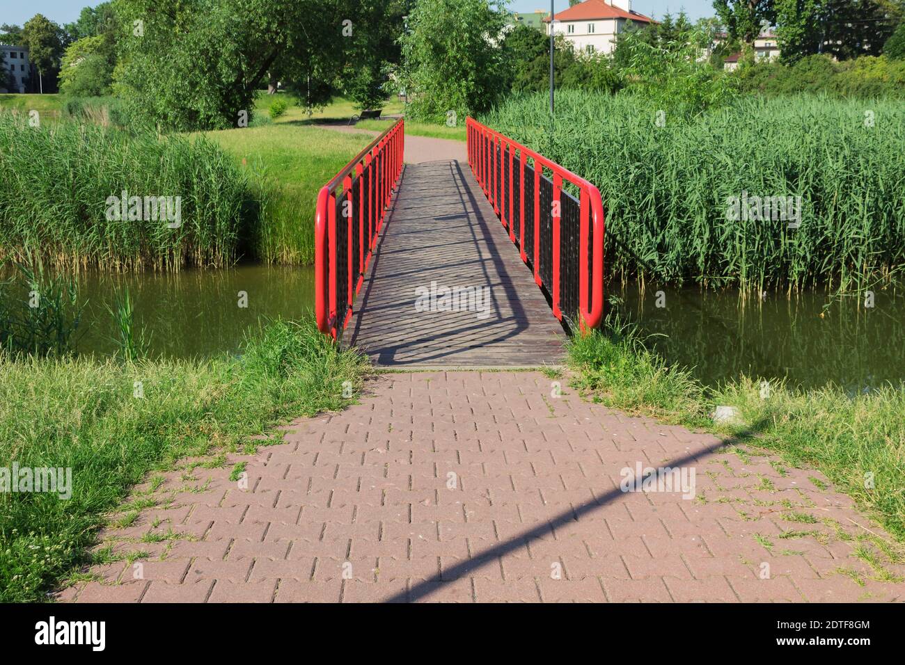 Red metal bridge over the river. Landscape and landscape Stock Photo ...