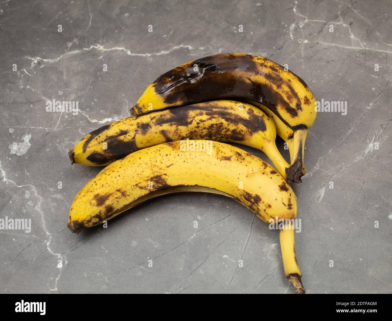 Rotten bananas and flies with larvae Stock Photo - Alamy