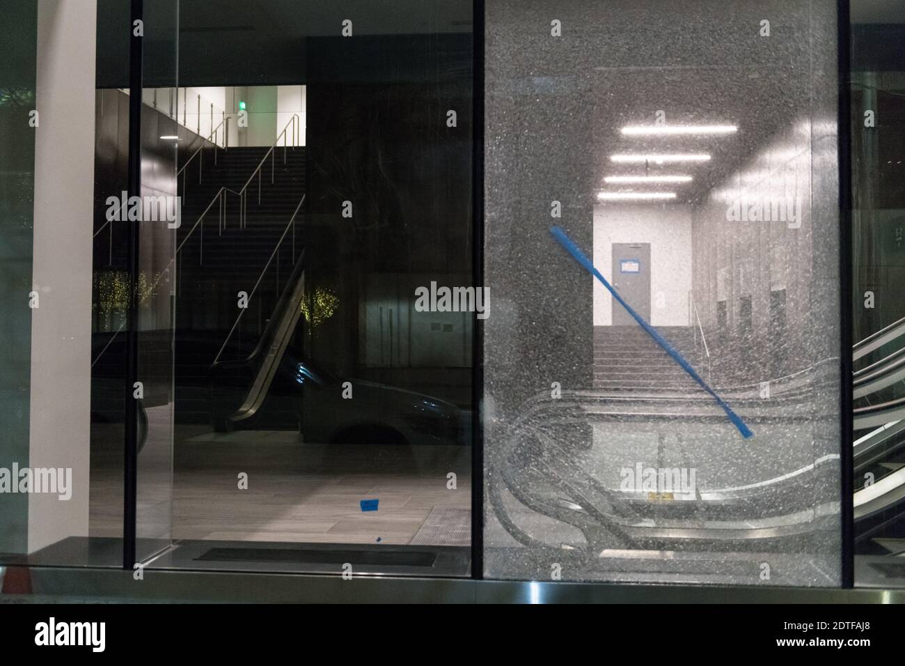 Seattle, USA. 12th Dec, 2020. A smashed window in the new Rainier ...