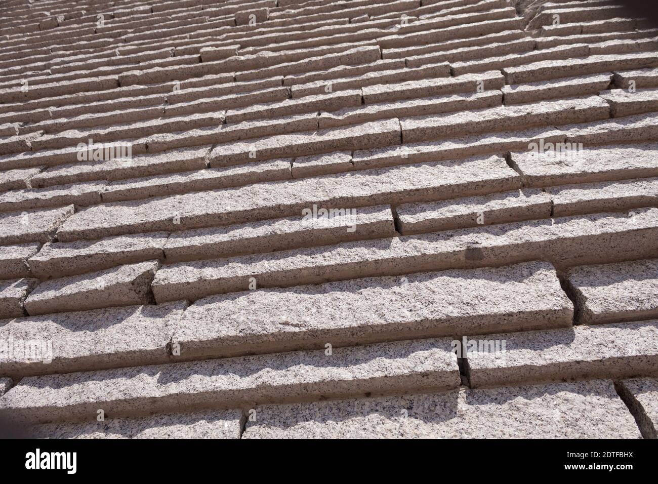 Textured wall made of granite slabs with a cascade Stock Photo - Alamy