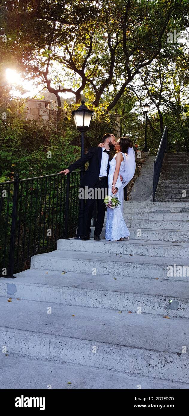 Kissing couple on stairs hi-res stock photography and images - Alamy