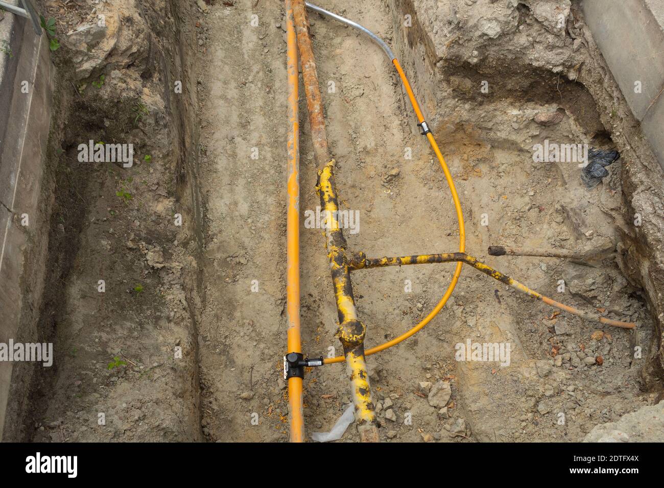 Fenced trench with underground utilities. Gas pipeline repair work on a ...