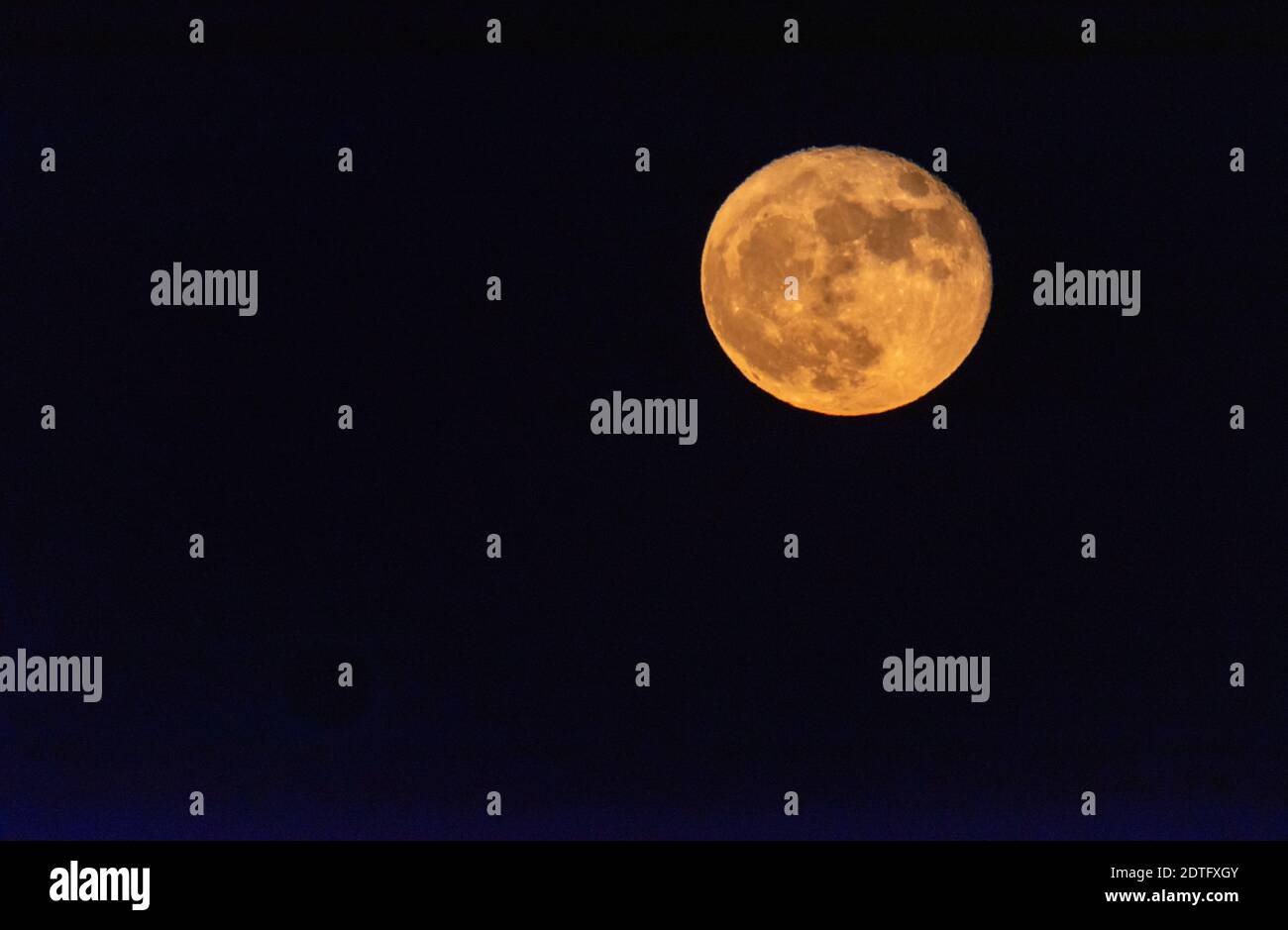 Nightfall with a full moon Stock Photo - Alamy