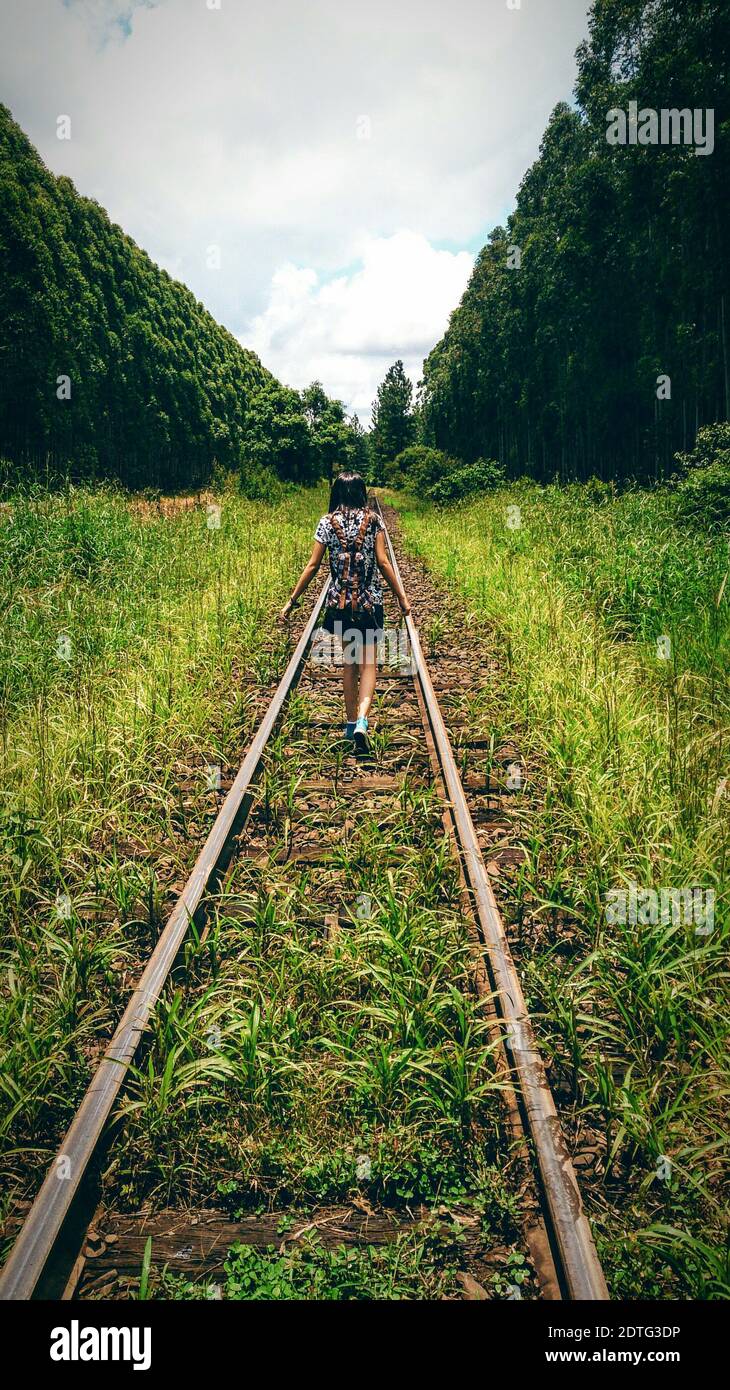 A Girl On A Train Tracks Stock Photo - Alamy