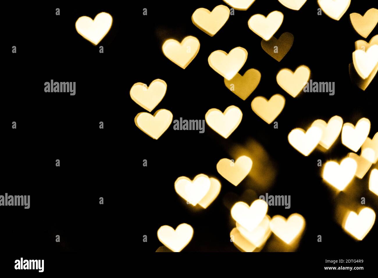 Golden heart bokeh background Stock Photo - Alamy