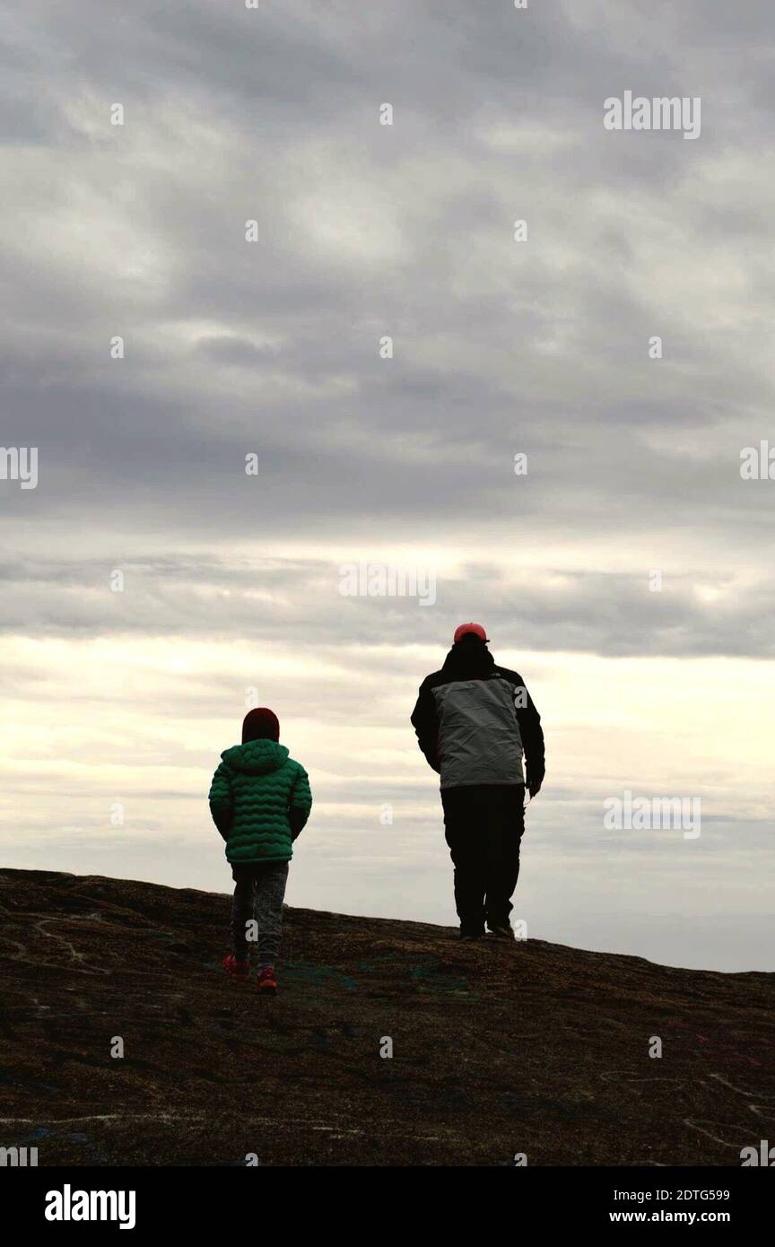 Silhouette two people standing edge hi-res stock photography and images ...