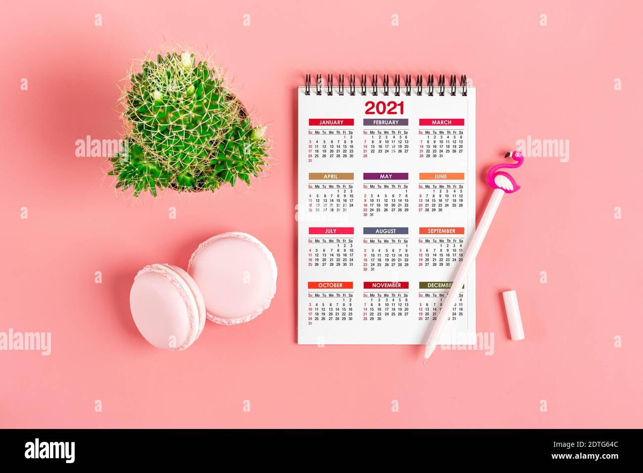 Open Calendar January 2021, candles, pen, sweets, succulents on pink ...