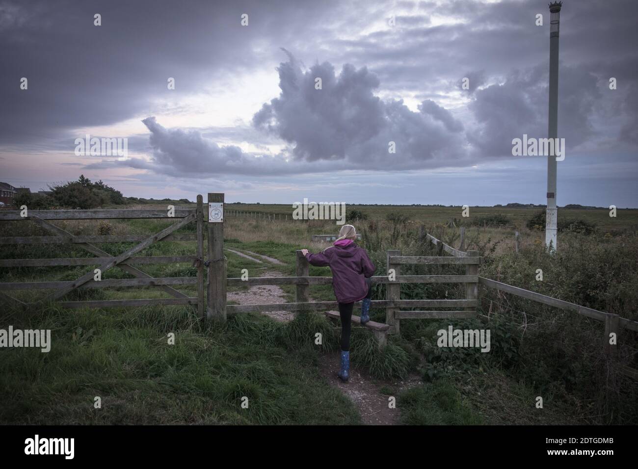 Child climbing on gate hi-res stock photography and images - Alamy