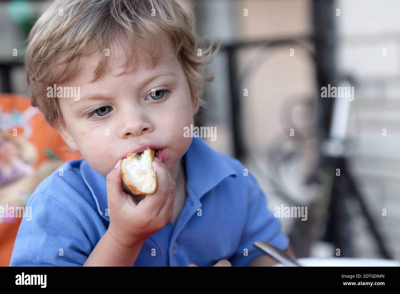 Boy with bun hi-res stock photography and images - Alamy