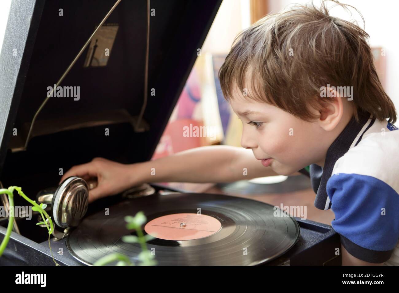 Child playing with gramophone in a museum Stock Photo - Alamy