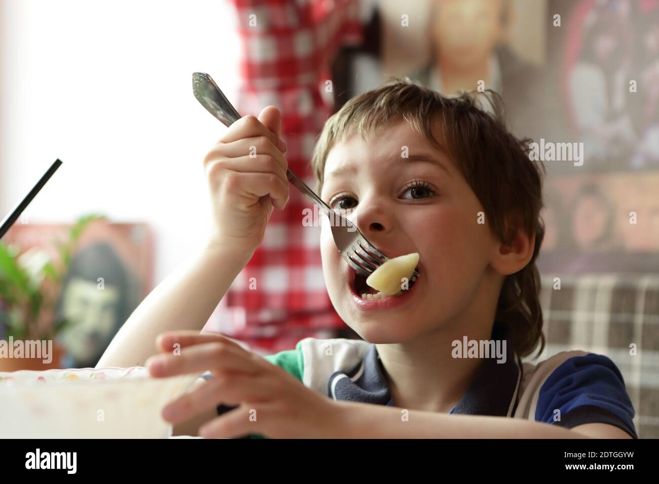 Kid eating dumplings in an ukrainian restaurant Stock Photo - Alamy