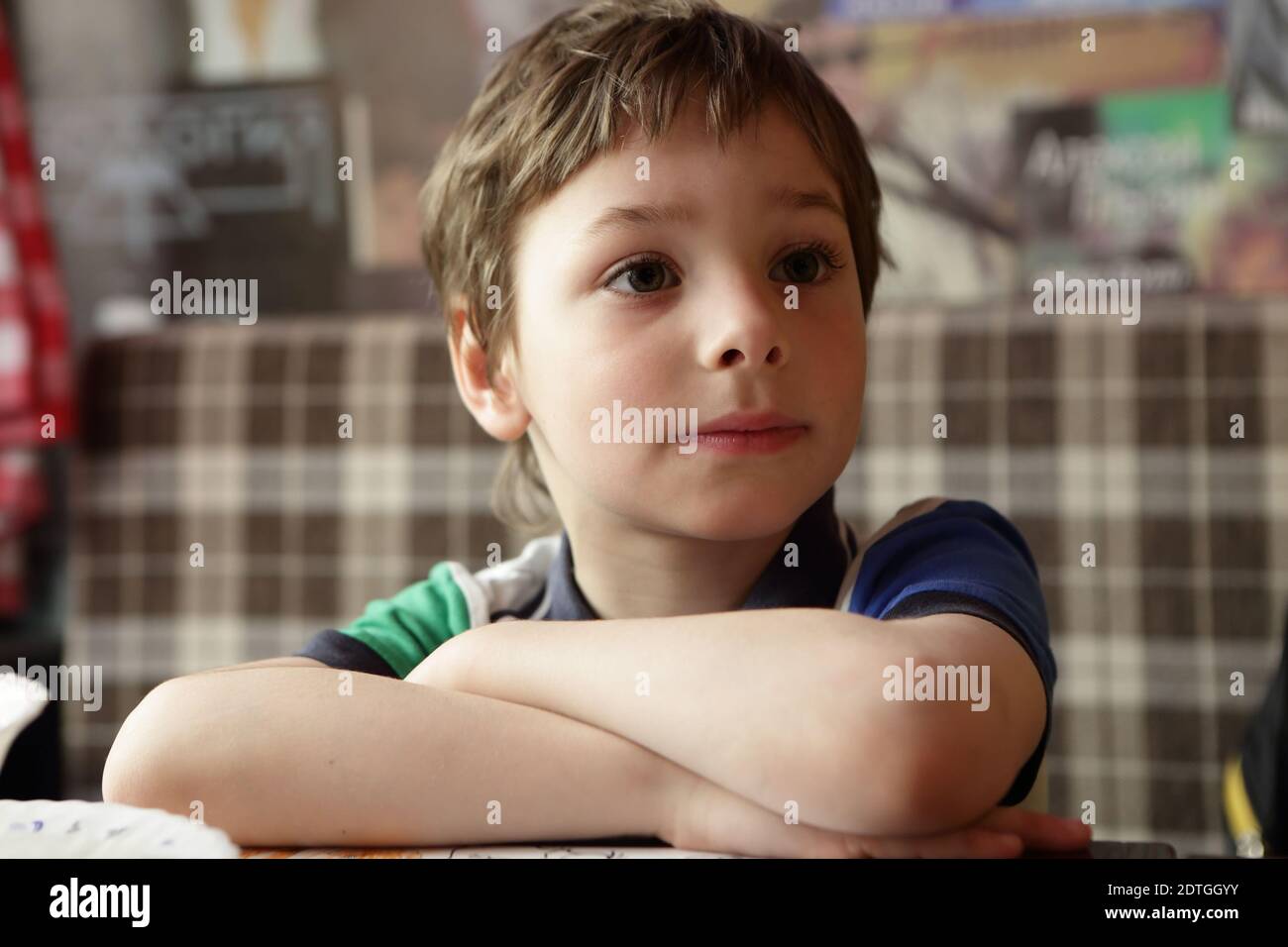 Portrait of a thinking child in cafe Stock Photo - Alamy